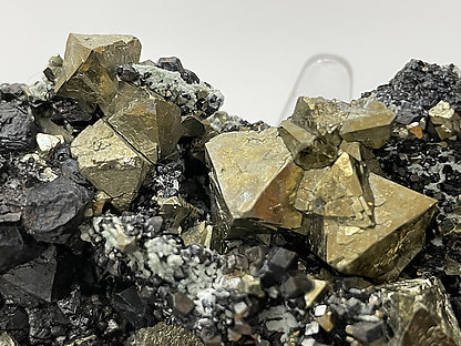 Mineral Specimen: Octahedral Pyrite with Magnetite and Calcite - Fabre ...